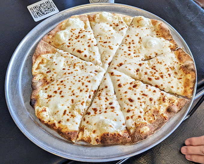 Sometimes simplicity is the ultimate sophistication. This cheese pizza is the blank canvas upon which barbecue masterpieces are built.