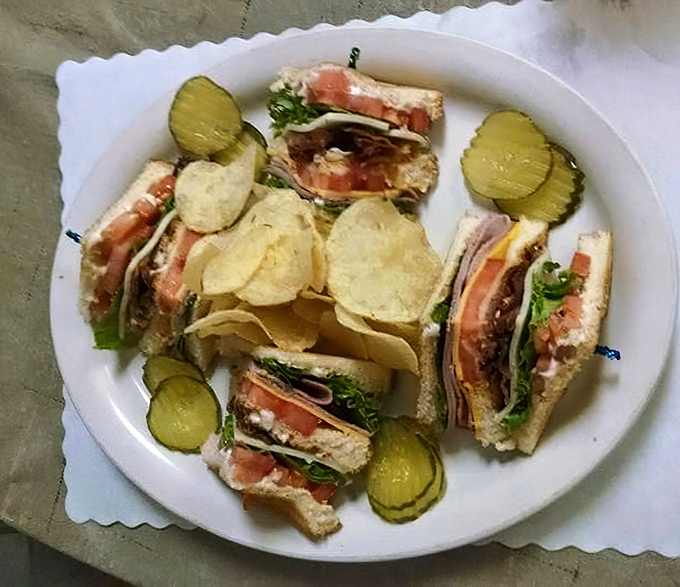 Club sandwiches: the architectural marvel of the lunch world, where each perfectly stacked layer deserves its own round of applause.