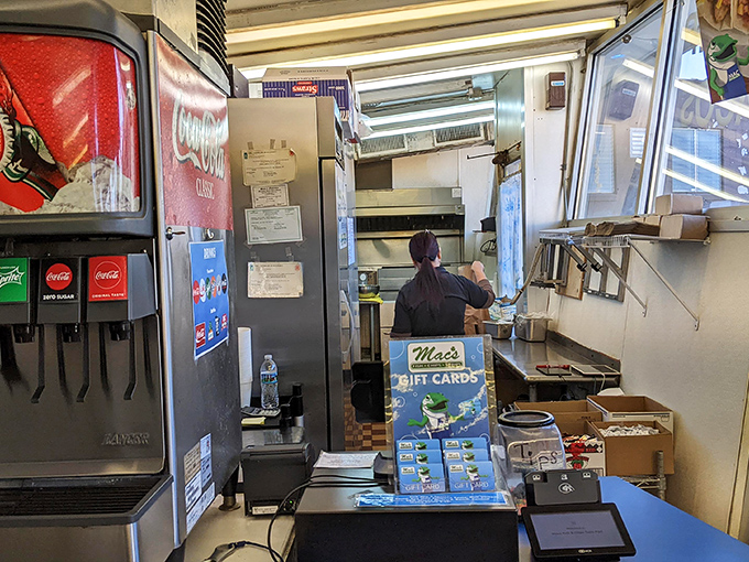 The beating heart of the operation: where seafood dreams come true. Those metal containers hold sauces worth their weight in gold.