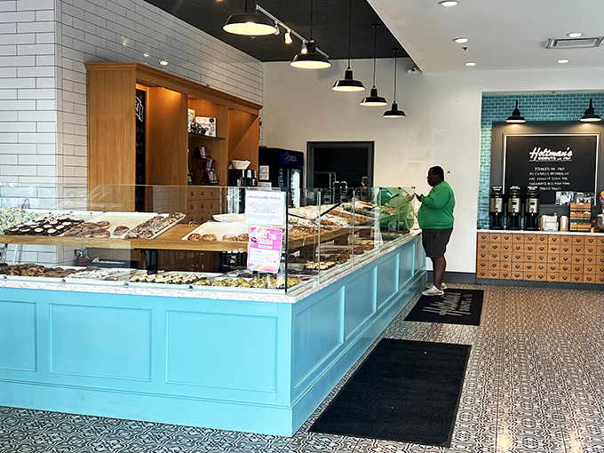 Behind this counter, donut magic happens daily. The display case is like a museum where all the exhibits are edible.