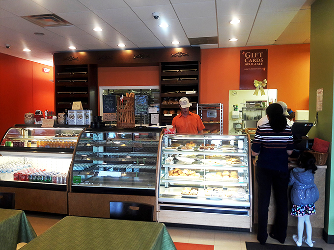 Behind this counter, magic happens daily. Like Willy Wonka's factory, but with significantly fewer Oompa Loompas and more croissants.