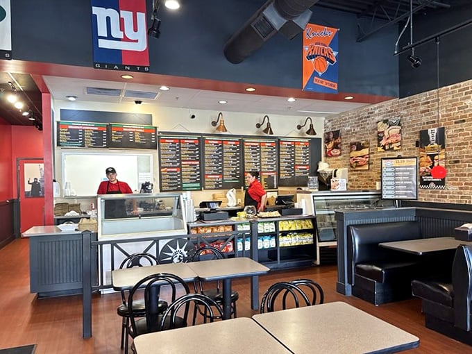The counter area is command central, where sandwich dreams become reality under the watchful eyes of New York sports legends on the walls above.