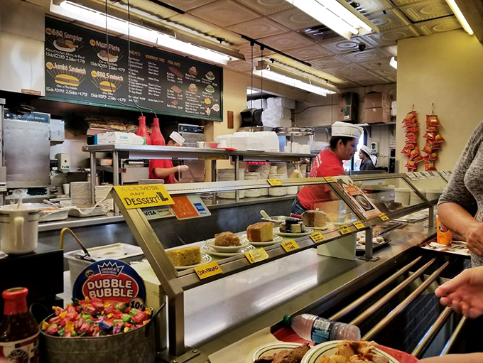 The counter where magic happens &ndash; desserts tempting you despite your belt's protests. The staff knows you'll cave eventually.