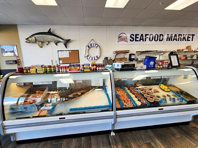 The seafood counter showcases the day's fresh catches, a glimmering display that feels like buried treasure in Oklahoma.