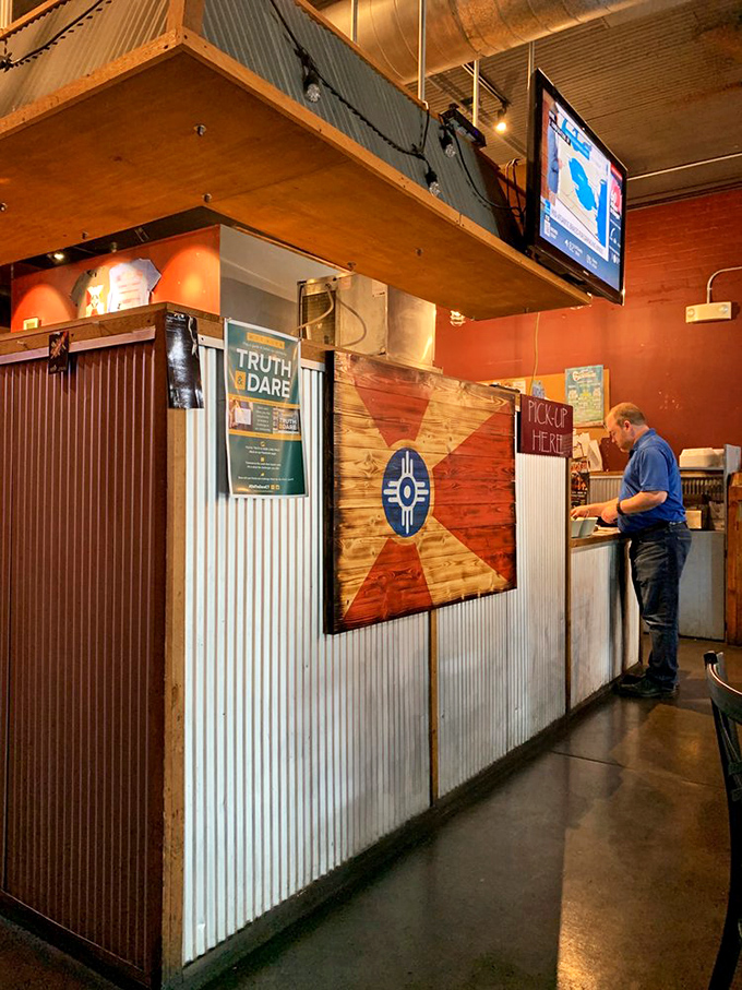 The Wichita flag proudly displayed at the counter&mdash;a reminder that regional barbecue isn't just food, it's cultural heritage with sauce.