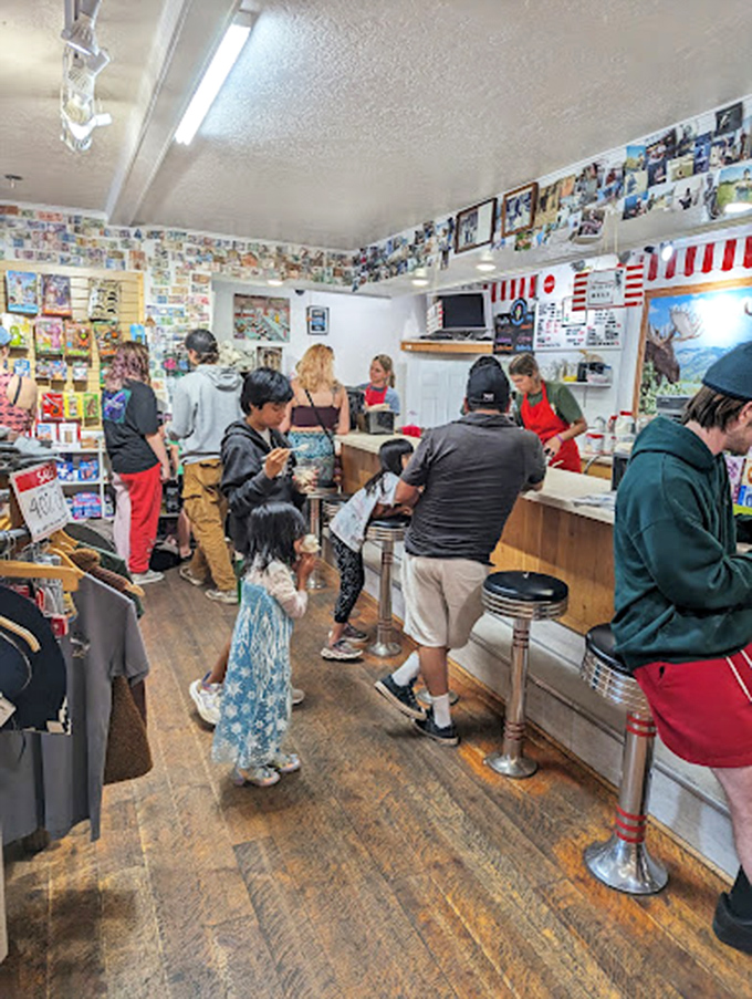 The line forms for Idaho's famous purple treat. Pilgrims of all ages gather at this ice cream altar, united in sweet anticipation.