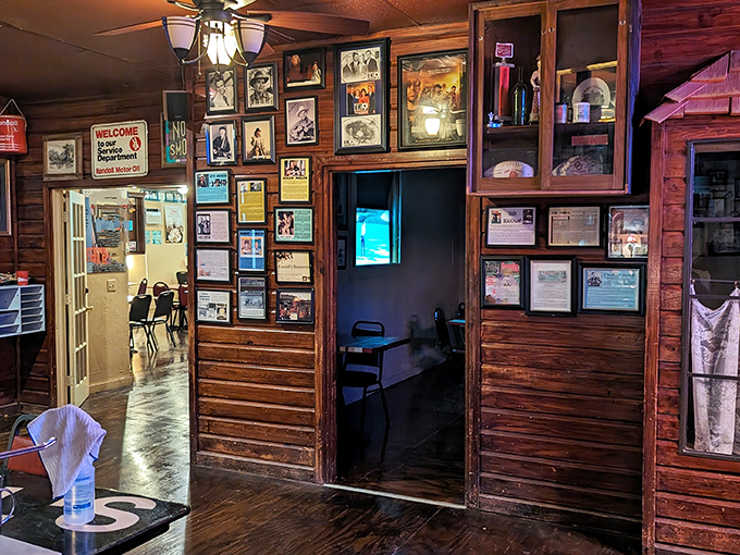 The wall decor creates a museum of Americana where guitars and photographs compete for attention while your food steals the show.