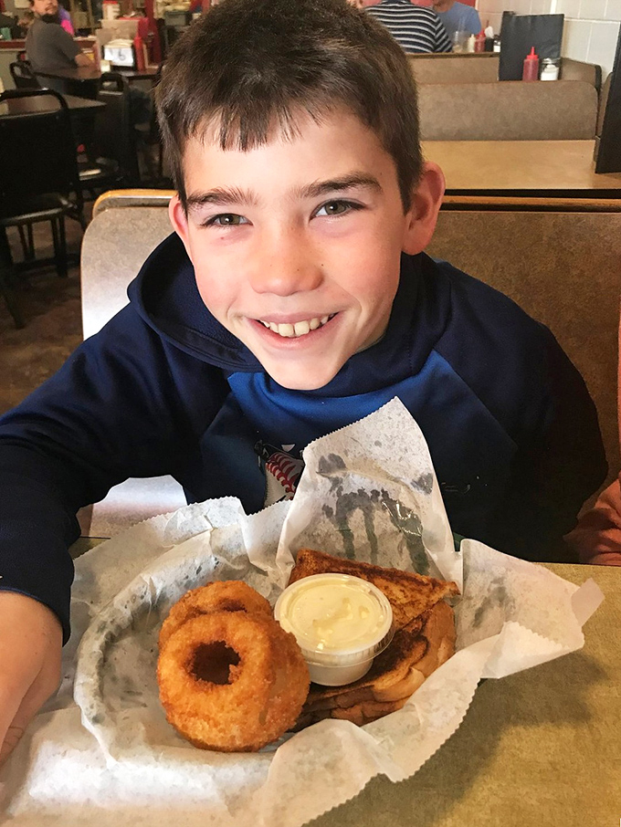 Crispy onion rings and simple pleasures&mdash;the smile says everything about why unpretentious local eateries still matter in our complicated food culture.