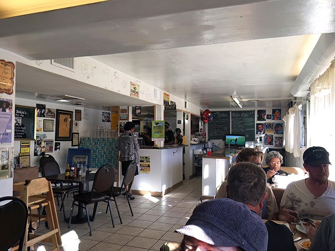 A busy lunchtime scene where strangers become temporary family, united by the universal language of exceptional Southern cooking and Phoenix hospitality.