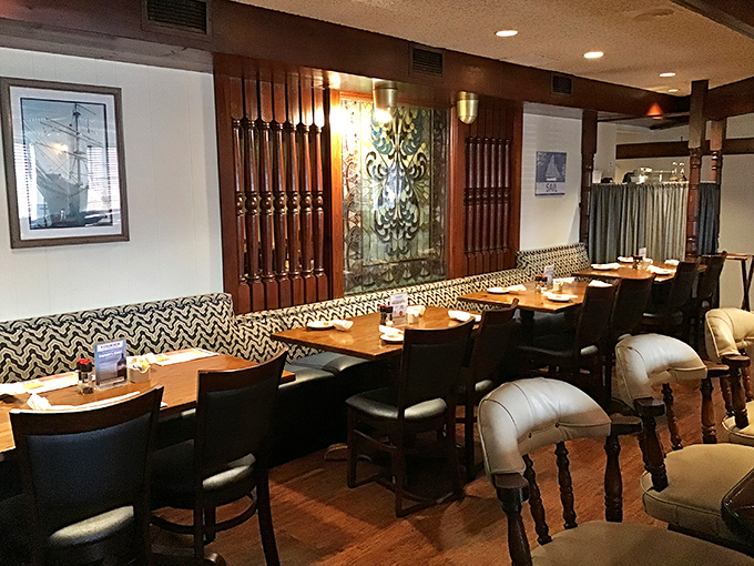 Nautical elegance meets homey comfort in this dining area where every seat feels like the captain's table.