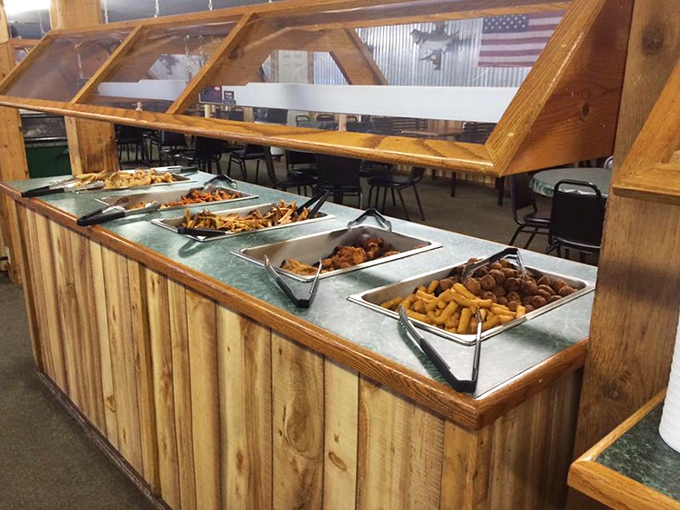 The buffet bar gleams under wooden-framed glass, a treasure chest of golden-fried delights that keeps Oklahoma pilgrims returning for more.
