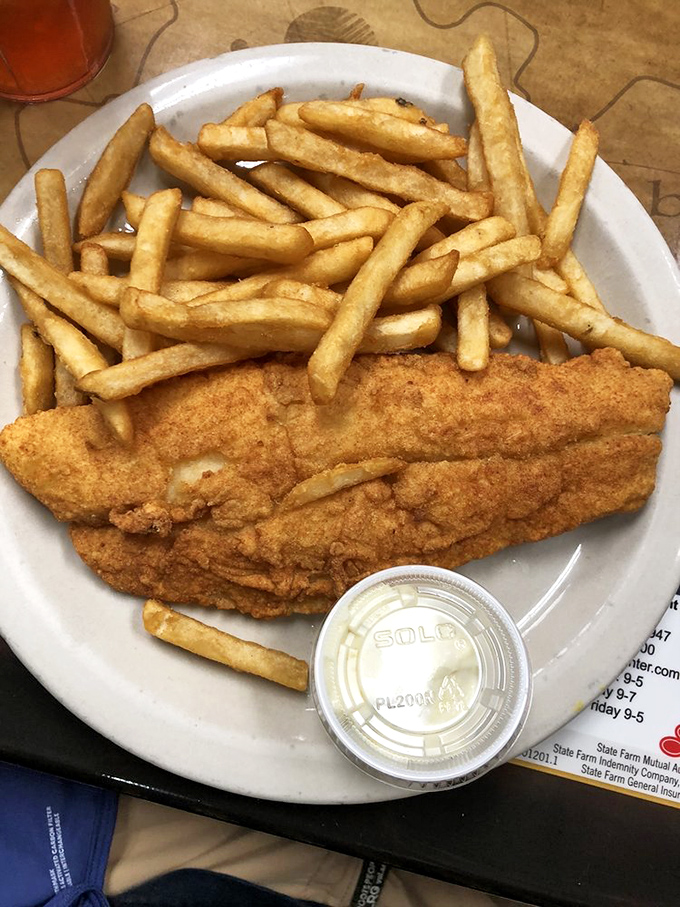 Golden-fried flounder that crackles with each bite, paired with fries that could start a family feud over who gets the last one.