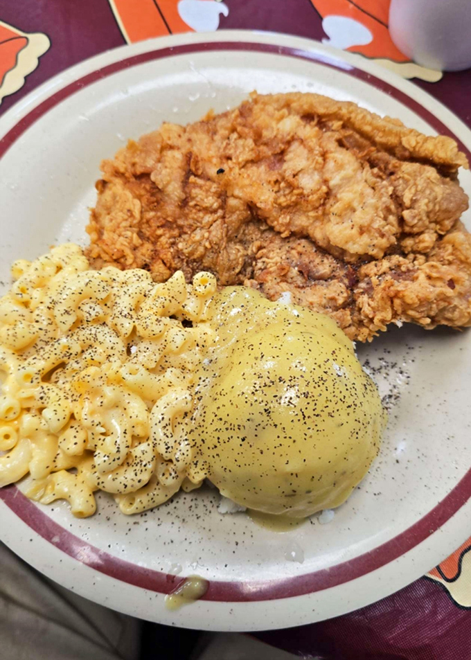 Fried chicken with the golden ratio of crispy to juicy, mac and cheese that's unapologetically rich, and a roll that's ready for gravy duty.