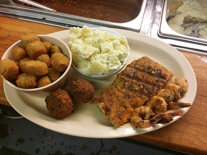 Southern comfort on a plate&mdash;crispy fried okra, creamy potato salad, and perfectly seasoned fish. Diet plans come here to die happy.