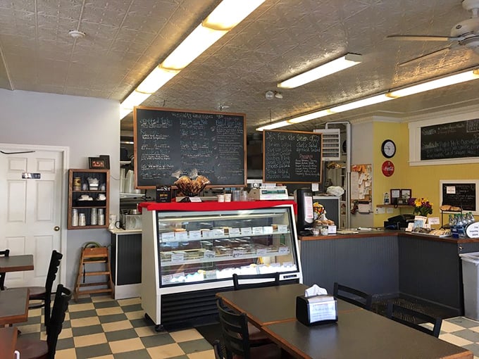 Where sandwich dreams begin. The display case shows off salads with the confidence of a peacock, while the menu boards loom with delicious possibilities.