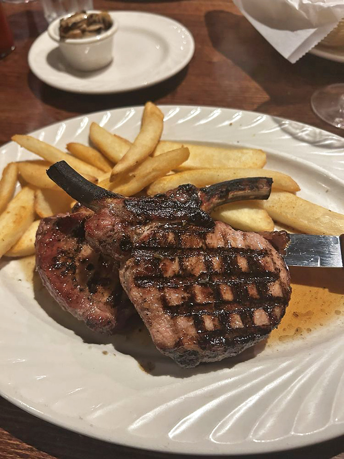 These pork chops have more perfect grill marks than a cooking show finale, proving that simplicity executed perfectly is culinary poetry.