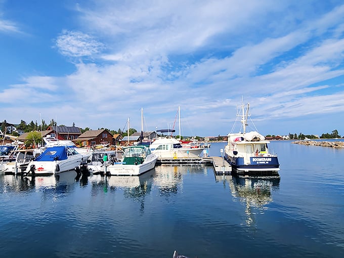 The marina's calm waters mirror the sky while boats wait patiently for their next journey across America's greatest lake.