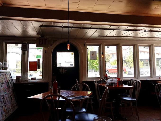 Natural light floods the dining room, creating that perfect "I could sit here all afternoon" ambiance that neighborhood gems are known for.