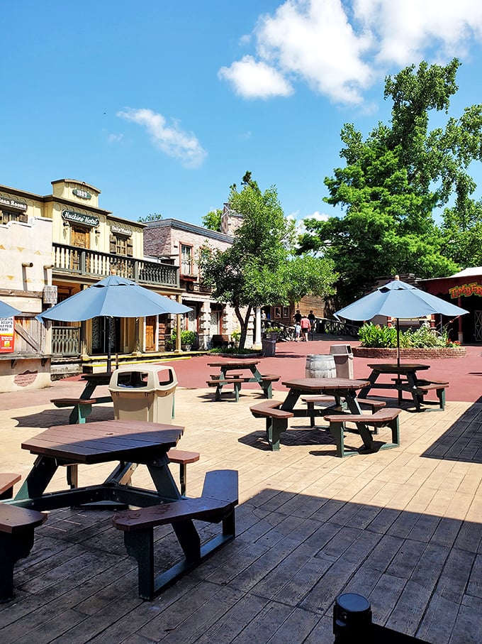 These shaded picnic tables in the heart of the Western-themed main street provide the perfect spot for families to refuel between adventures.