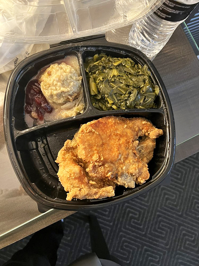 A trio of Southern comfort: fried catfish, collards, and cornbread. The holy trinity of soul food presented with unpretentious perfection.