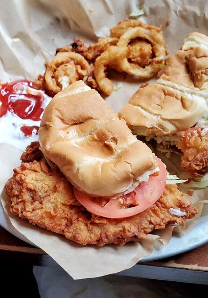 The pork tenderloin sandwich&mdash;where the meat extends well beyond the boundaries of the bun&mdash;comes with a side of onion rings that deserve their own fan club.