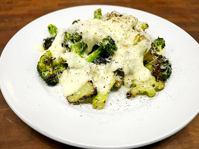 Roasted broccoli under a blanket of cheese sauce&mdash;because even vegetables deserve to dress up for a night out at a smokehouse.