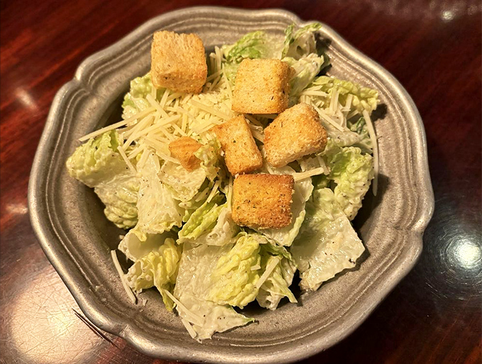 A Caesar salad that reminds you vegetables can be more than an obligation—crisp romaine, savory croutons, and just enough Parmesan to make you temporarily forget about steak.