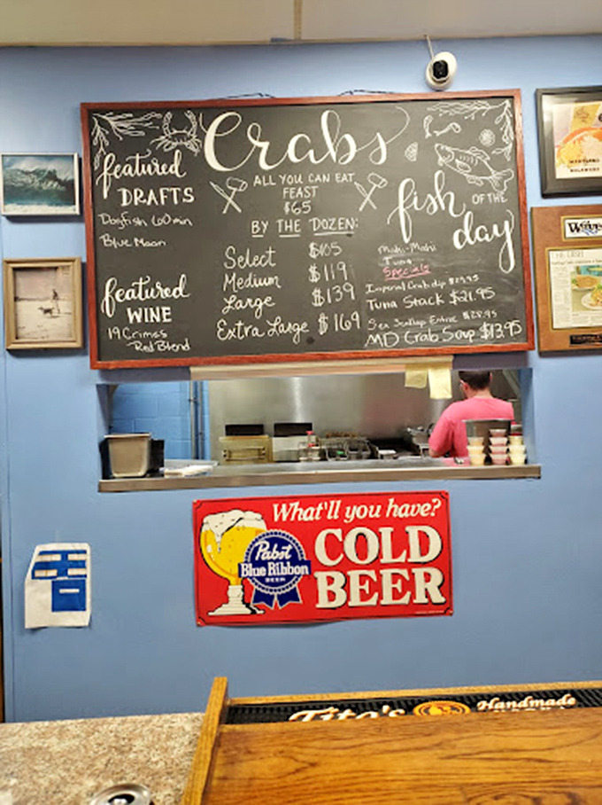 Some see a simple menu board, I see a roadmap to happiness with all roads leading to perfectly seasoned crustaceans.
