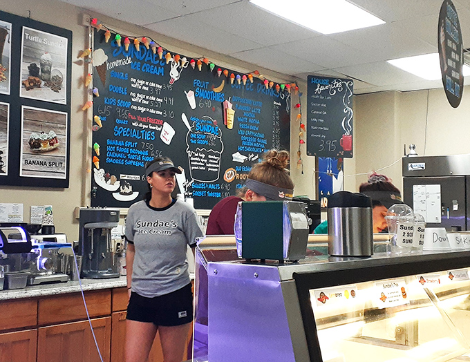 Behind the counter, ice cream artisans orchestrate the daily symphony of scoops and toppings. That focused expression? It's the look of dessert dedication in action.