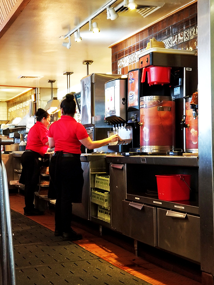 The staff moves with the practiced efficiency that comes only from years of balancing plates, refilling coffee, and remembering who ordered what.