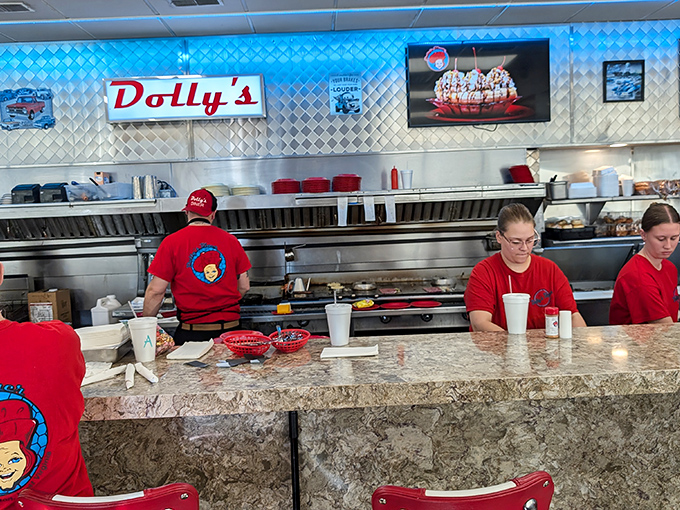 The red-shirted kitchen crew works with the synchronized precision of a NASCAR pit team. These are the unsung heroes of hash brown perfection.