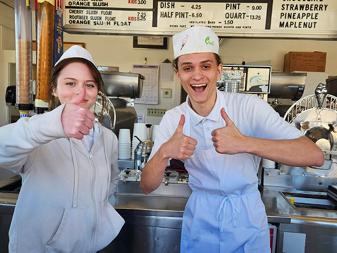 The custard crew gives thumbs up, ready for another day of making memories. Behind every great dessert stands a team that knows the power of simple pleasures.