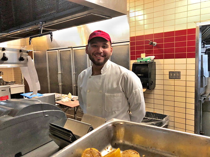 Behind every great seafood dish is a passionate chef. The smile says it all&mdash;pride in bringing ocean flavors to the desert.