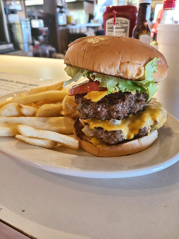 This isn't just a burger&mdash;it's a skyscraper of beef, cheese, and fresh veggies that requires jaw exercises before attempting.