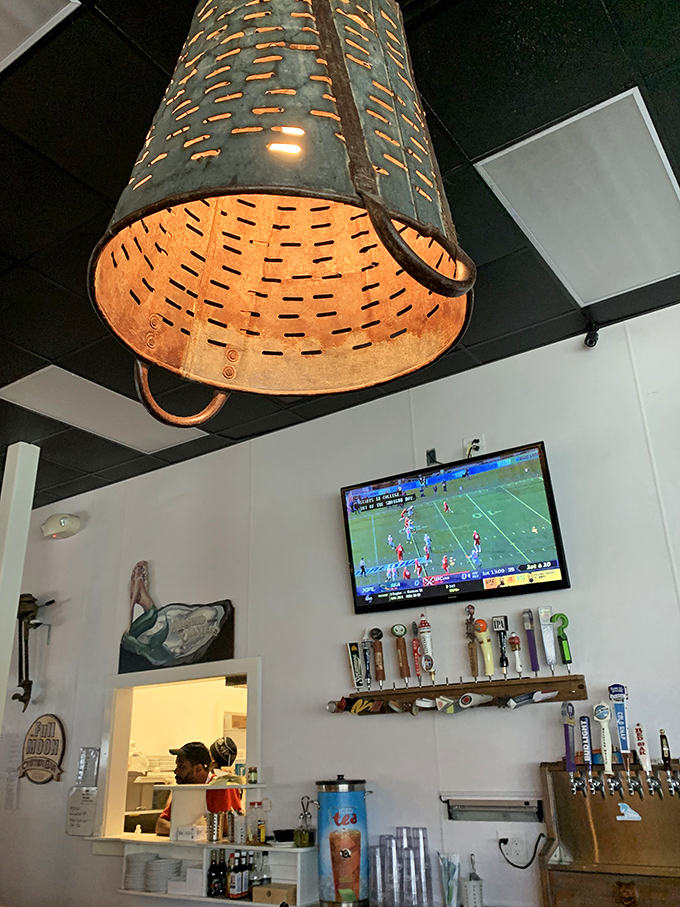 Those aren't just oyster baskets hanging from the ceiling&mdash;they're clever light fixtures illuminating seafood wisdom from above.