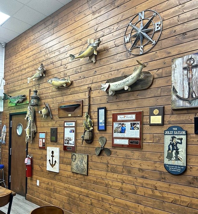 Not just decoration, but a maritime museum on wood paneling. Each mounted fish tells a story of "the one that didn't get away."