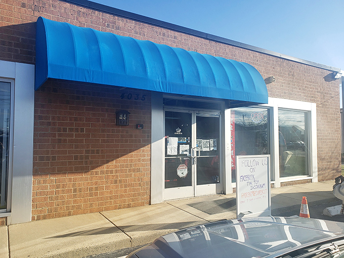 The bright blue awning of Hidden Treasures invites curious shoppers inside. This boutique thrift experience proves secondhand shopping can feel first-class.