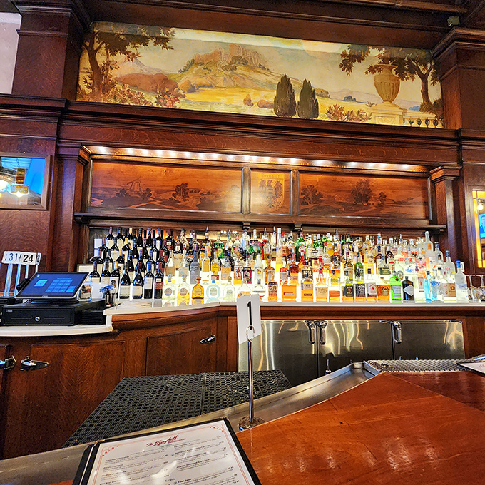 Behind the bar stands a liquid library&mdash;bottles organized with the precision of a German train schedule, ready to fulfill any libation request.