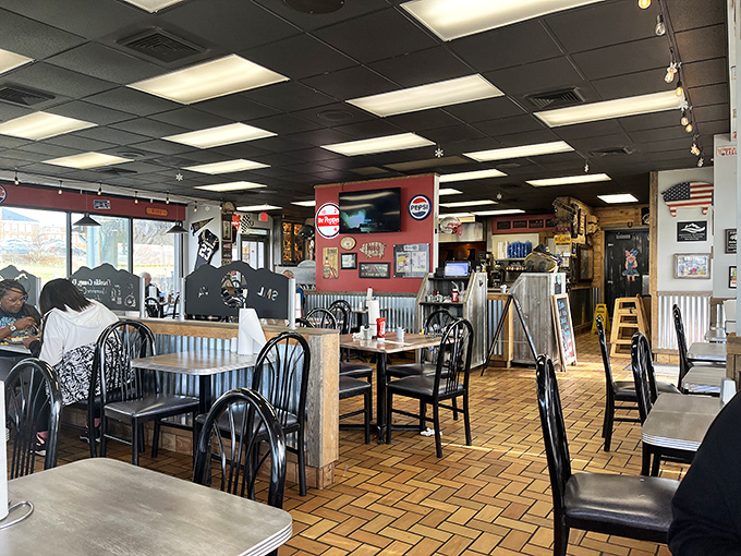 Red walls, wooden accents, and barbecue memorabilia create the perfect backdrop for the serious business of enjoying smoked meats.