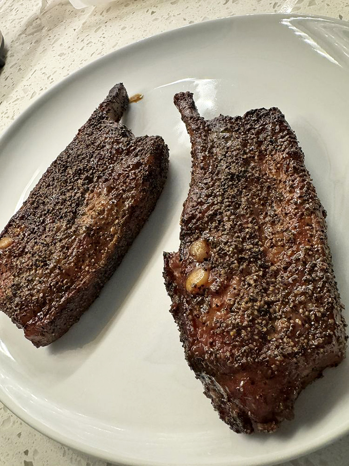 Ribs with a bark so perfect they could win a Westminster Dog Show for meat. That peppery crust is the tuxedo these ribs wore to impress you.