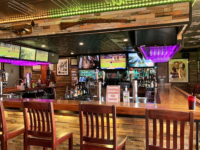 The bar area strikes that perfect balance between sports-watching haven and serious drinking establishment. Those purple lights aren't just ambiance&mdash;they're a mood.