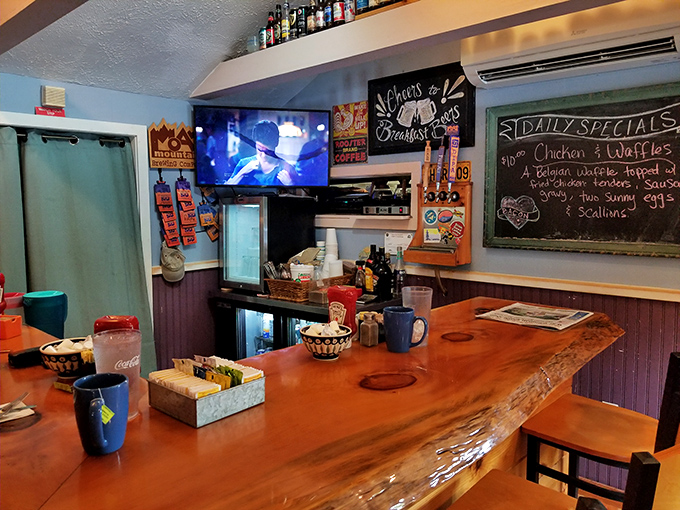 The bar where breakfast dreams come true. That live-edge wooden countertop has heard more morning confessions than a Sunday church.