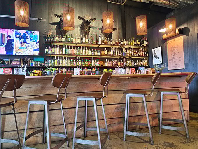 The bar isn't just serving drinks&mdash;it's offering liquid punctuation for your barbecue sentences. Those longhorn mounts silently approve.