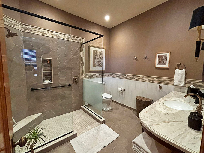 A bathroom renovation that respects history while acknowledging that indoor plumbing is humanity's greatest achievement. Those hexagon tiles are speaking to me.