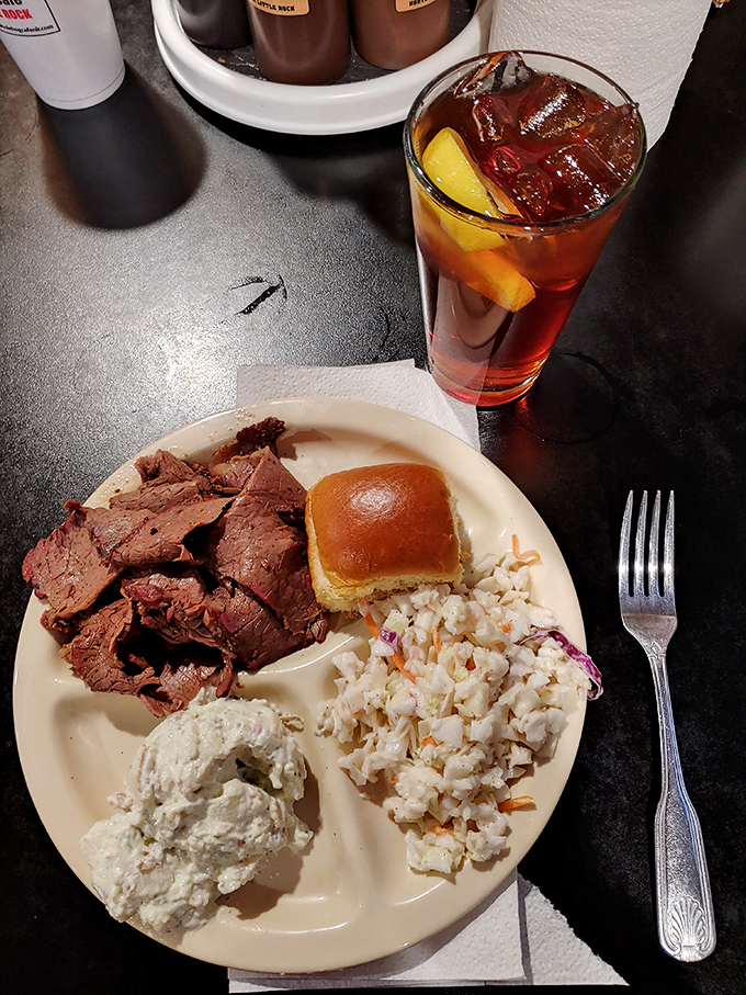 Brisket sliced to perfection alongside classic southern sides. Add sweet tea and you've basically achieved peak Arkansas dining nirvana.