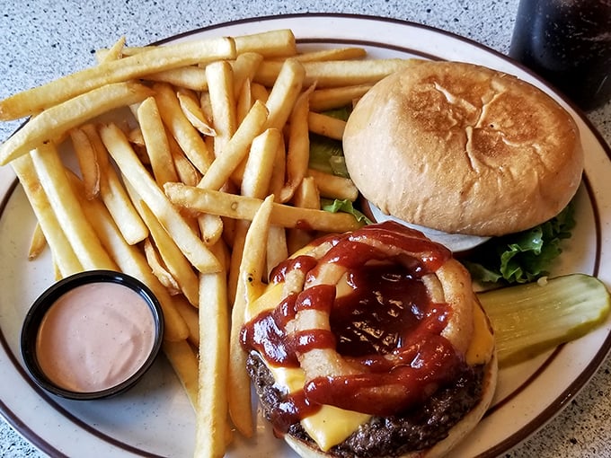 Burger artistry at its finest &ndash; this juicy masterpiece with its glistening cheese and BBQ sauce proves simple pleasures are often the most satisfying.