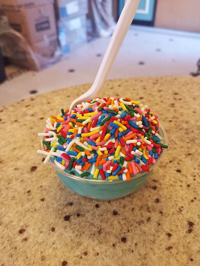 Blue ice cream topped with a rainbow explosion of sprinkles&mdash;because sometimes your inner eight-year-old deserves to order dinner without adult supervision.
