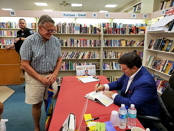 The sacred ritual of the book signing: a moment of connection between creator and reader, immortalized with a stroke of the pen.