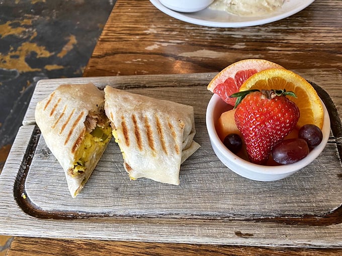 A breakfast burrito cut in half reveals its splendid secrets &ndash; a morning promise that whatever follows will surely be better.