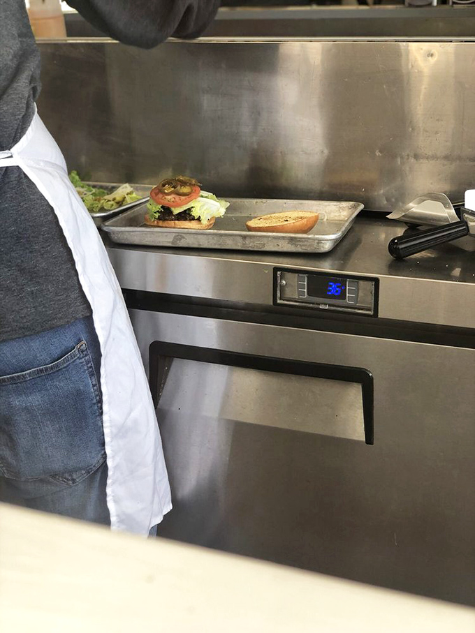 Behind every great burger is a dedicated cook and a perfectly organized prep station. Culinary choreography at its finest.